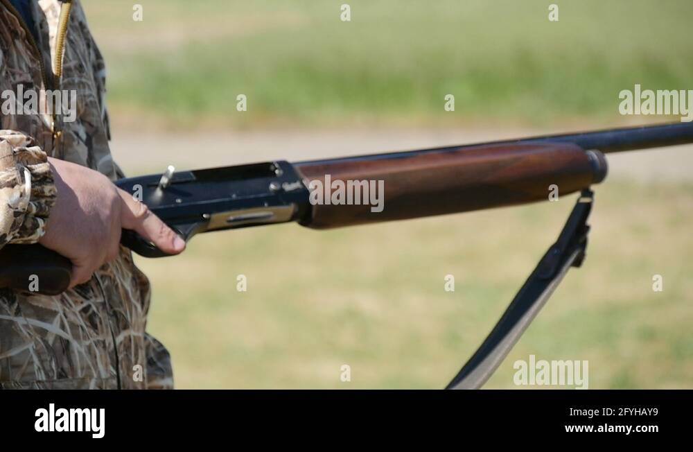 Rifleman loading the breech of his single-barrel shortgun on a range in ...