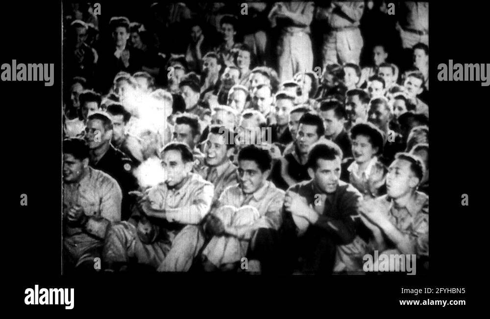 1940s: Soldiers sit in audience at nightclub, clapping. Dinah Shore ...
