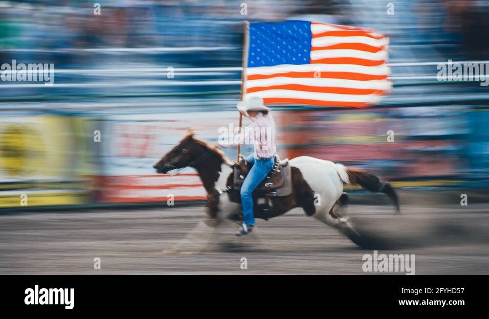 Woman riding horse in rodeo with American flag Cinemagraph Stock Video ...