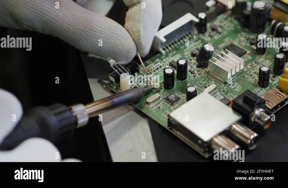 BGA chip soldering on the soldering station. Removal of temperature ...