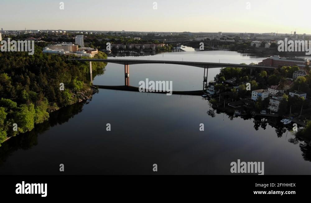 Aerial footage of the Stockholm island Stora Essingen and its tramway ...