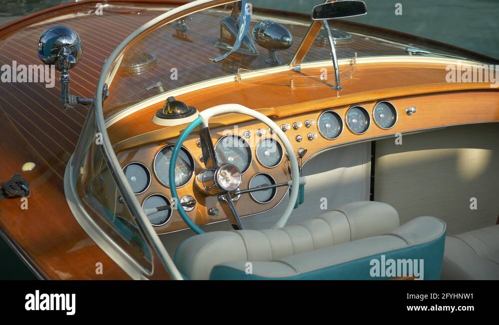 Detail of the cockpit on a classic luxury wooden runabout boat, slow ...