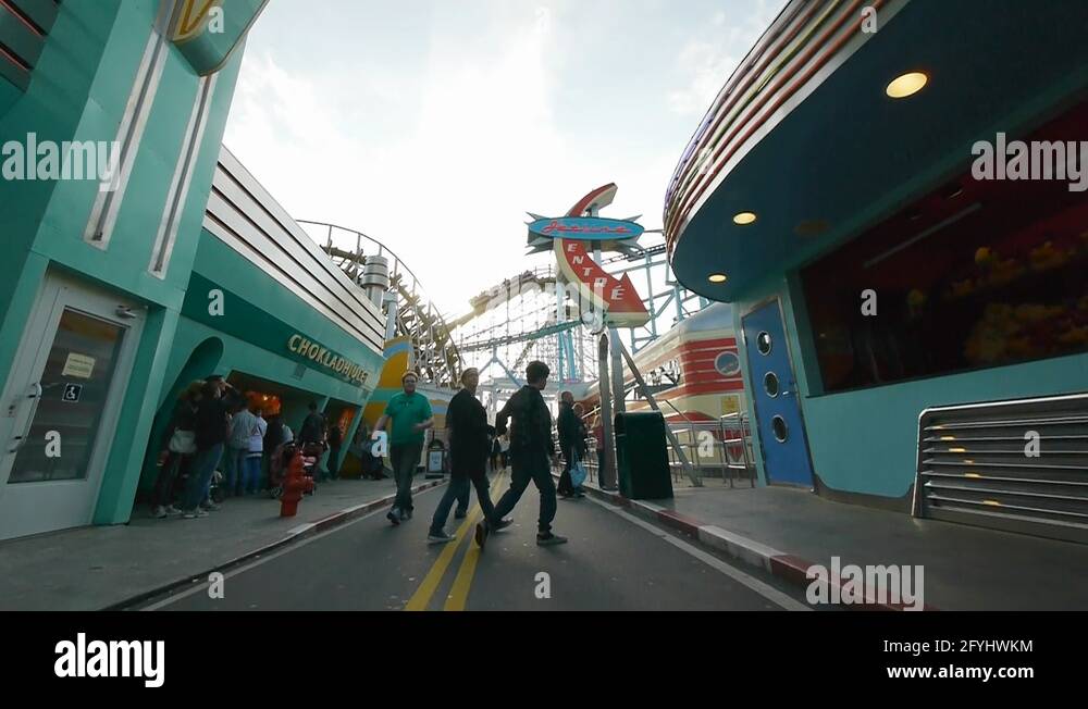 Amusement Park Excitement. A Fairground With Carnival Rides And Happy ...