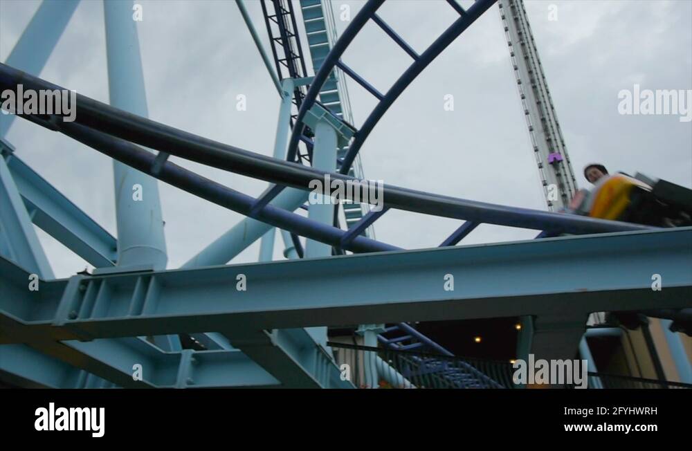Amusement Park Excitement. A Fairground With Carnival Rides And Happy ...