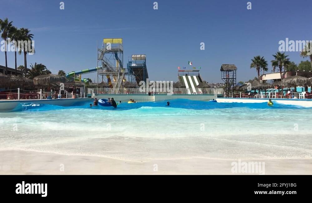 People in wave pool at a water park in slow motion Stock Video Footage ...
