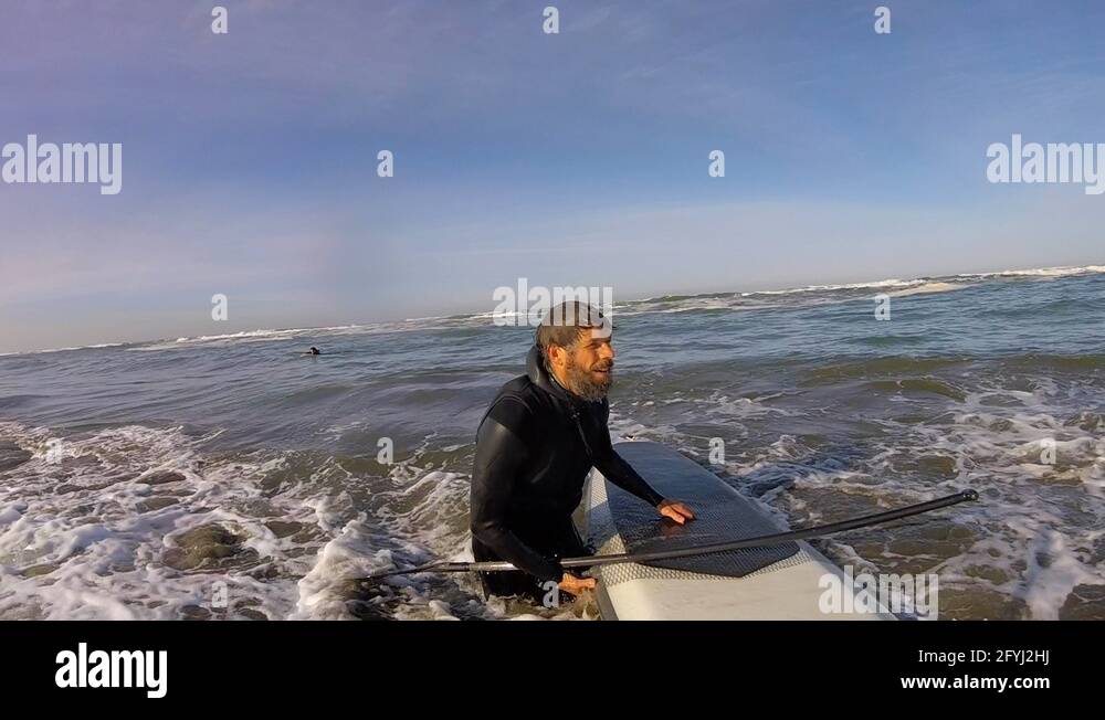 Man carrying paddleboard Stock Videos & Footage - HD and 4K Video Clips ...