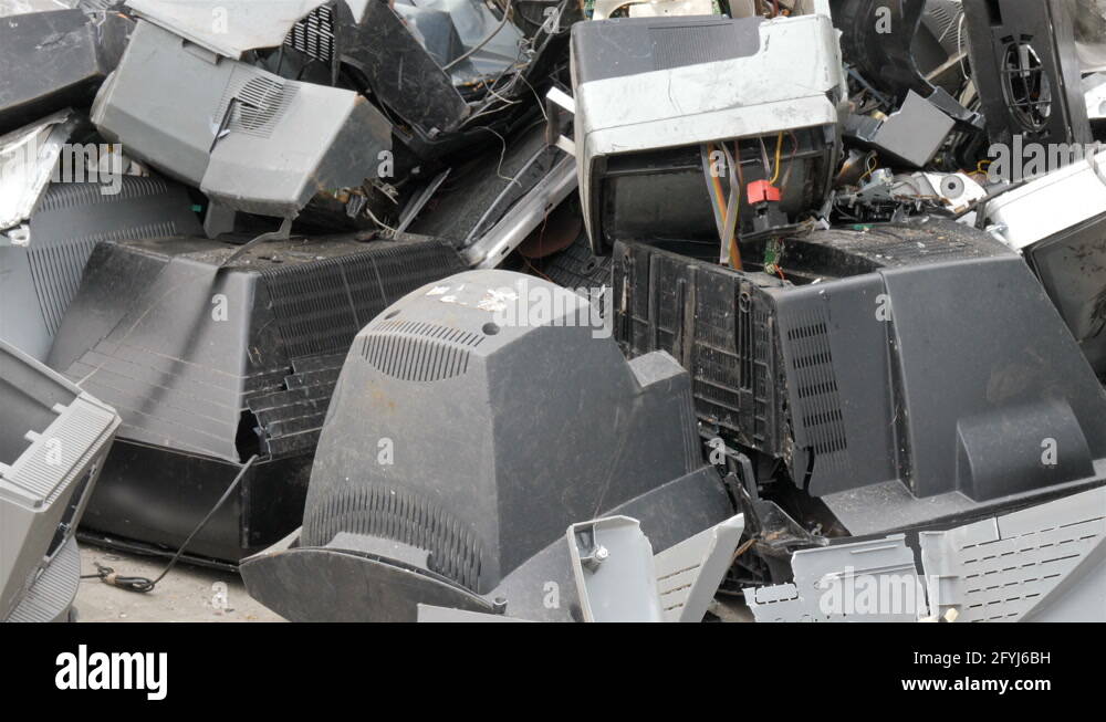 Electronic waste collection point. Woman brings an old monitor Stock ...
