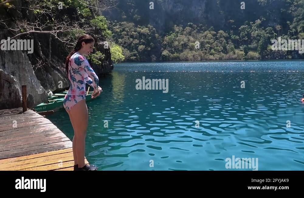 Philippines, Palawan, Coron, Lake Barracuda, Girl Diving in Barracuda ...