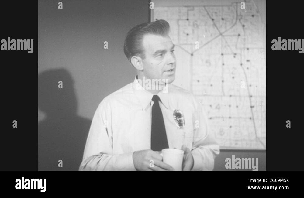 1950s: Police officer and Sergeant talk Stock Video Footage - Alamy