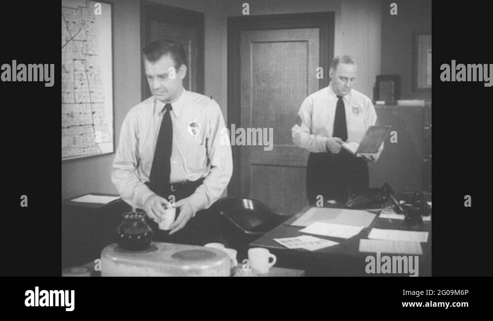 1950s: Police officer and Sergeant talk. Sergeant reads from a citation ...