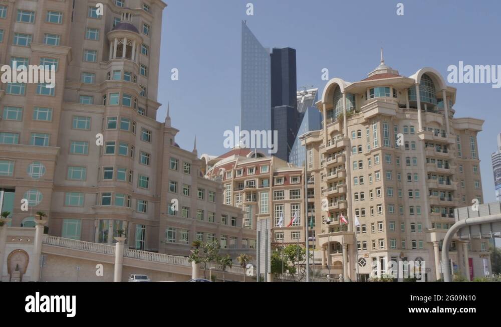 Tall Buildings and traffic on Al Sa'ada Street in Downtown, Dubai ...
