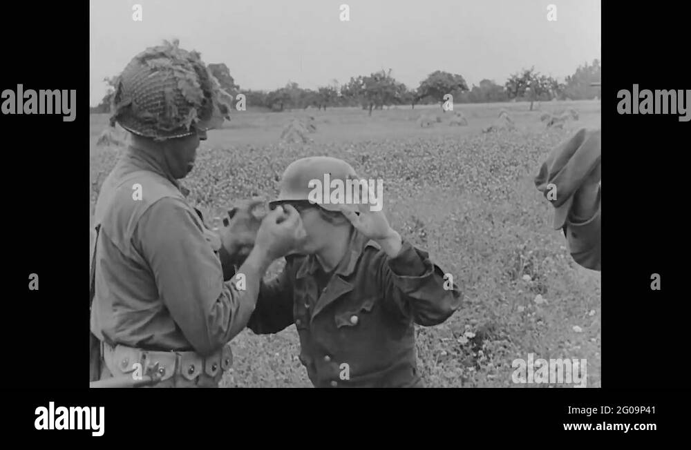 WW2 - German soldier in captivity check by US soldier Stock Video ...