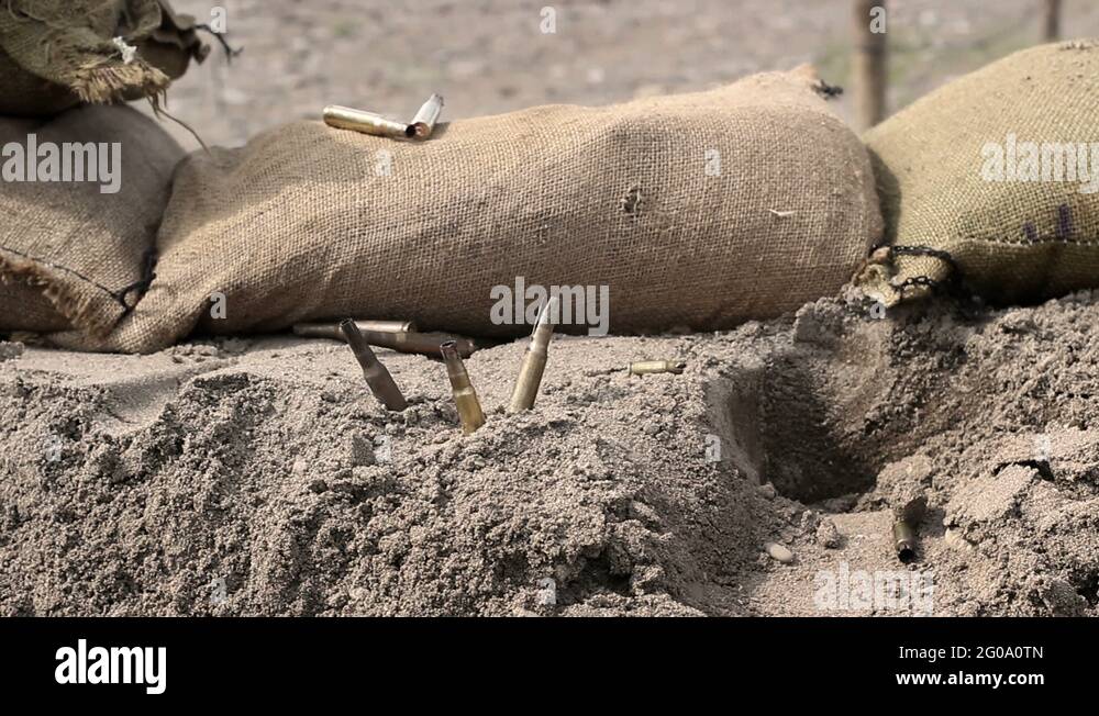 World War Two - Machine gun Shell Casings at sandbag trench at omaha ...