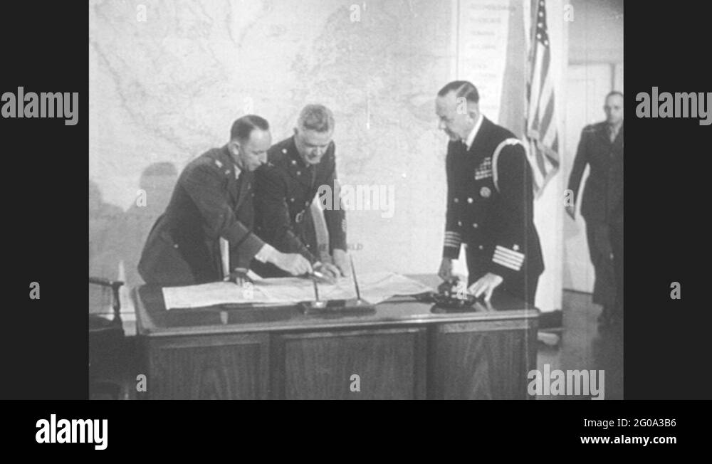 1940s: UNITED STATES: men in uniform look at maps in office Stock Video ...