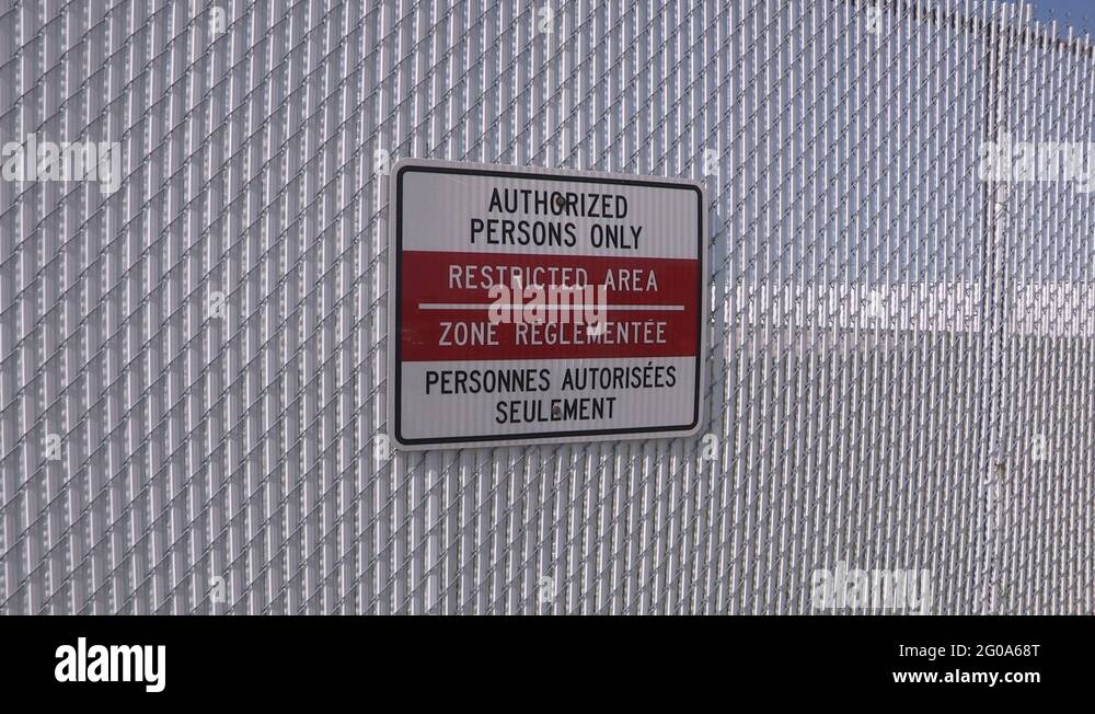 Airport security restricted area warning sign Stock Video Footage - Alamy