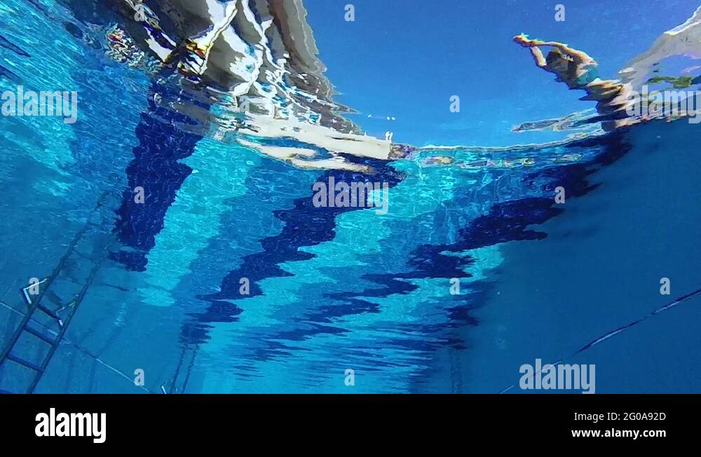 girl jumping into the pool Stock Video Footage - Alamy