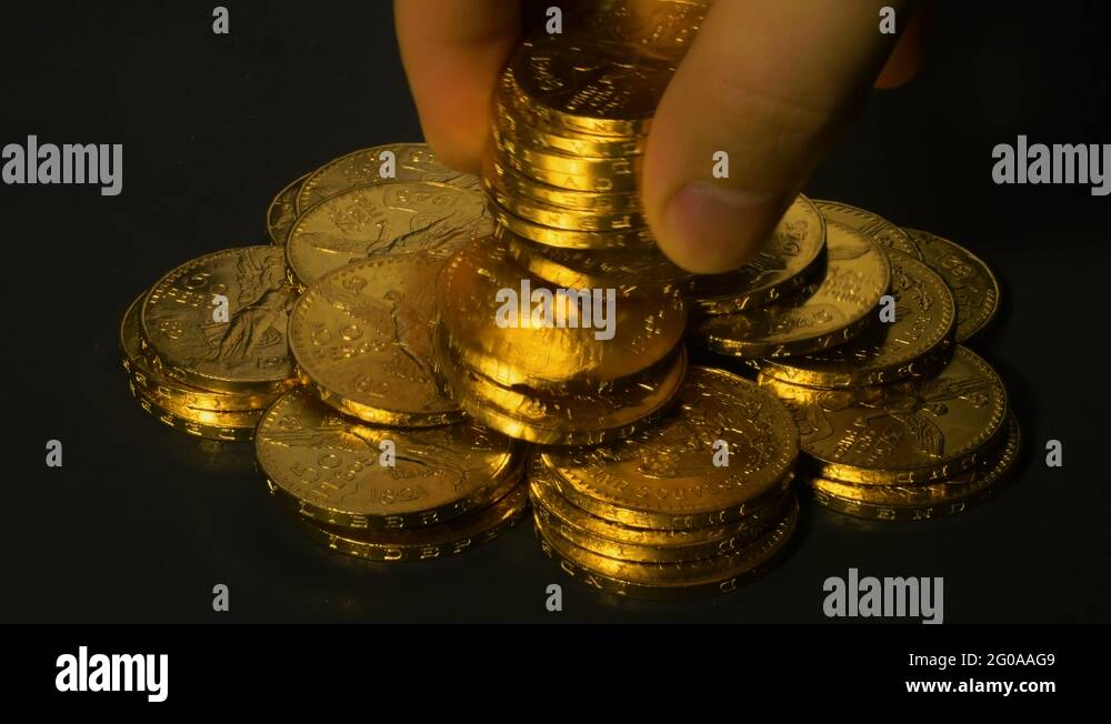 Gold coins falling hand Stock Videos & Footage - HD and 4K Video Clips ...