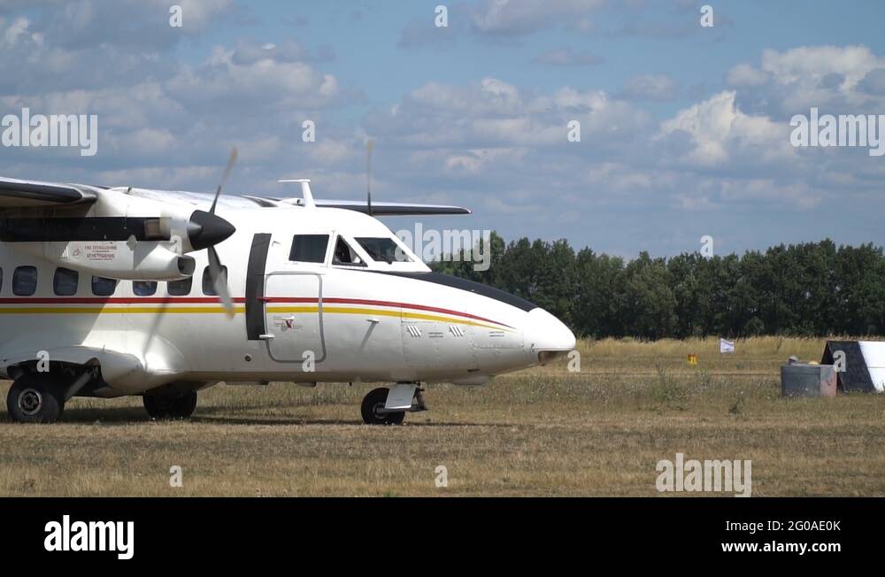 At the plane L-410 goes around the field and is preparing to fly from ...