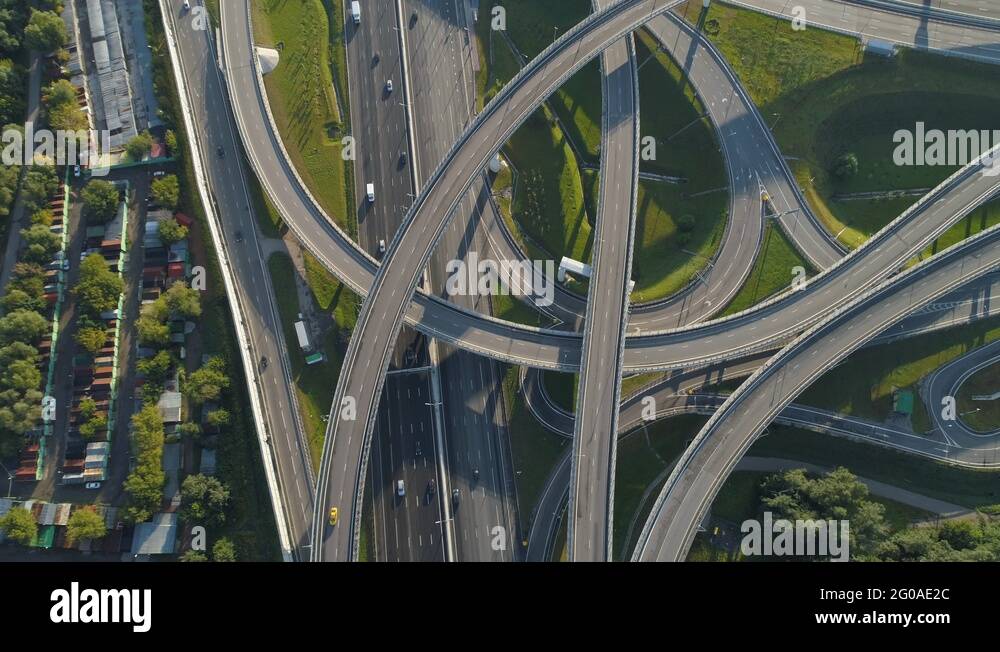 Multi-level road junction and cars traffic. Camera is tilting up ...