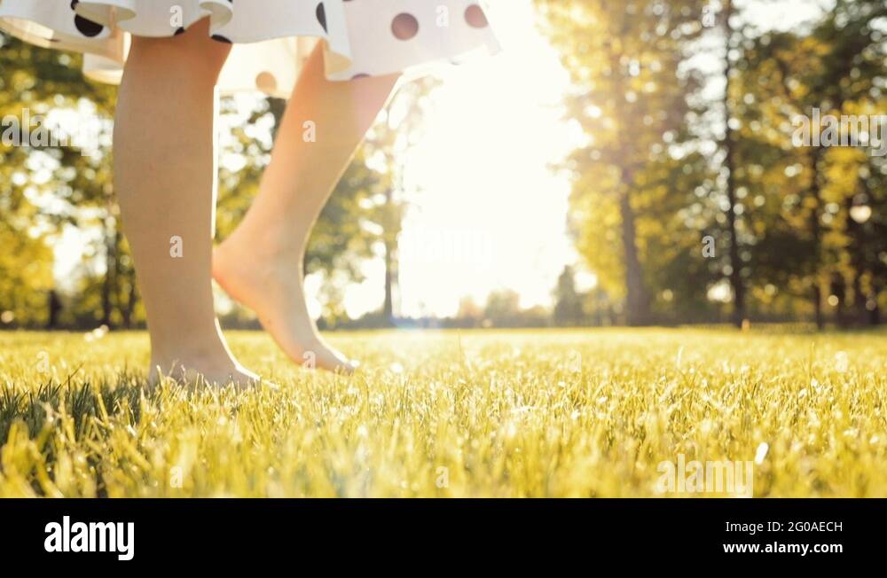 Barefoot Woman Feet Walking in the Green Grass. 4K DCi SLOW MOTION ...