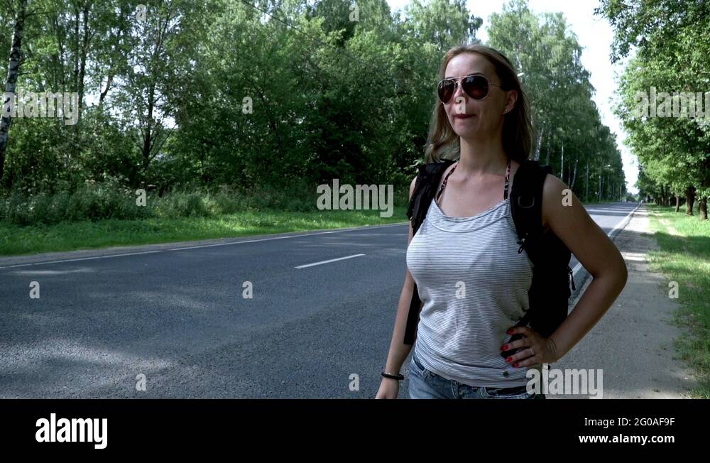 Hitch hiking woman backpack Stock Videos & Footage - HD and 4K Video ...
