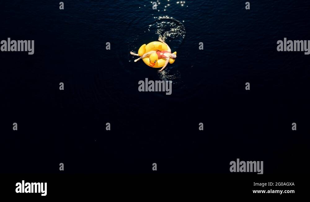 Beautiful woman relaxing on an inflatable raft in the ocean Stock Video ...