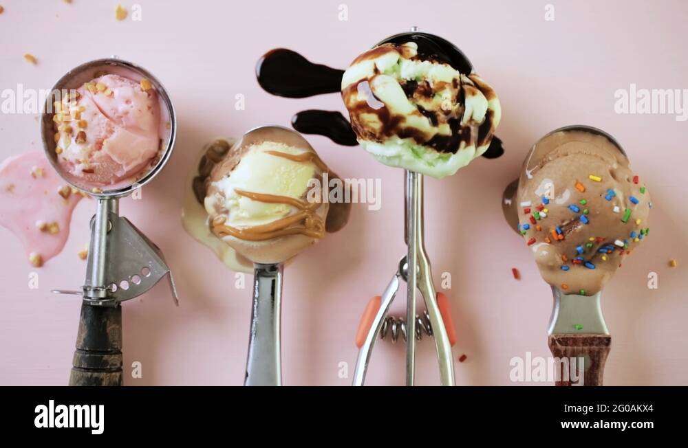 Melting ice cream. Variety of metal ice cream scoops with different ice ...