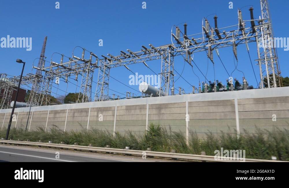 Slo mo highway shot driving by urban Transformer station. DVP in ...