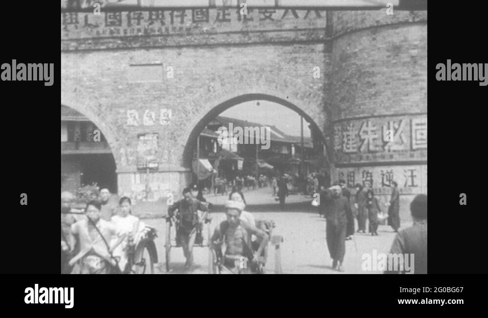 1940s: People walk through arches of city, ride on rickshaws. People ...