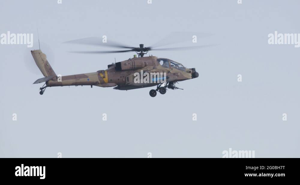 Apache military helicopter firing hellfire missile Stock Video Footage ...