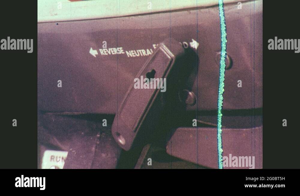 1970s: Outboard Motor Gear Lever In Forward. Boy Sitting In Boat Pulls ...