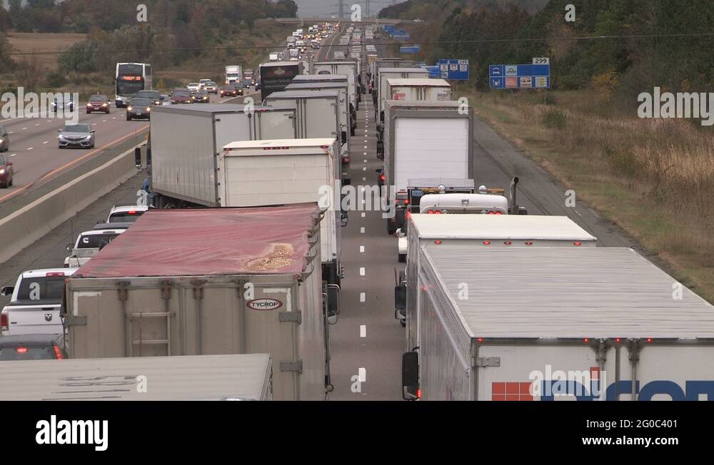 Tractor trailer trucks stuck in epic highway traffic jam and gridlock ...