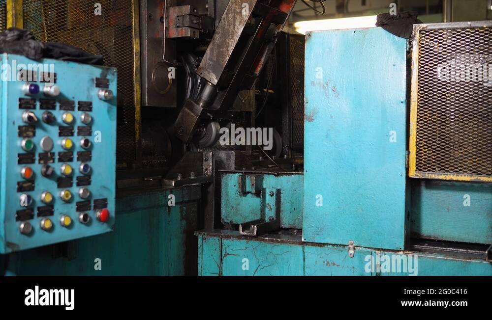 Automated rolling press machine is making humps on wheels for cars ...