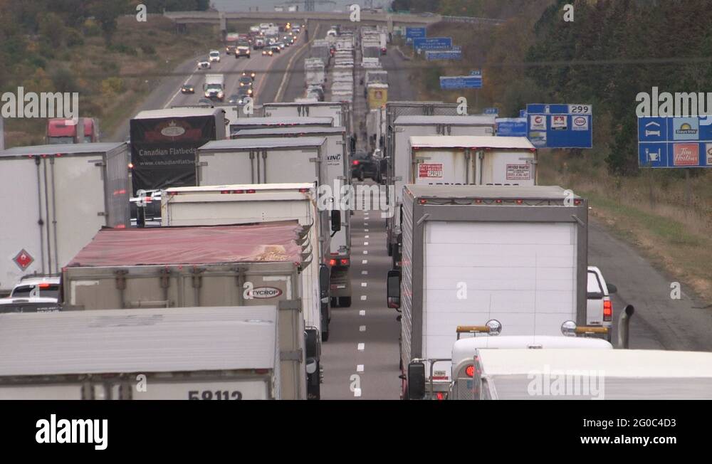 Tractor trailer trucks stuck in epic highway traffic jam and gridlock ...