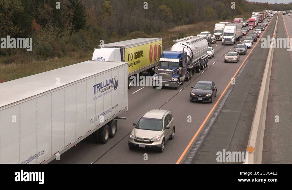 Tractor trailer trucks stuck in epic highway traffic jam and gridlock ...
