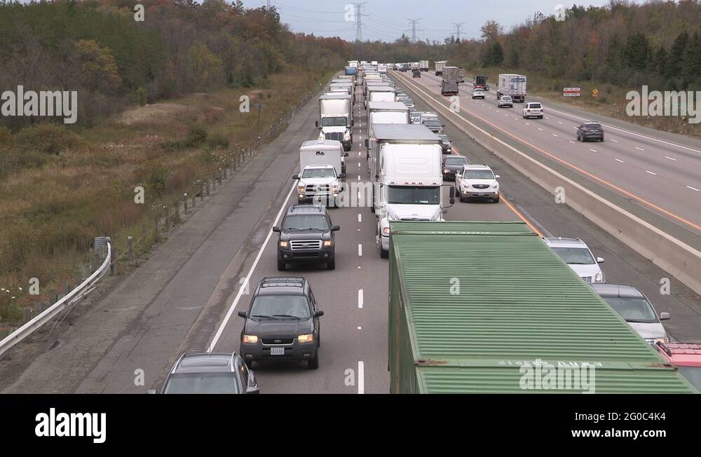 Tractor trailer trucks stuck in epic highway traffic jam and gridlock ...