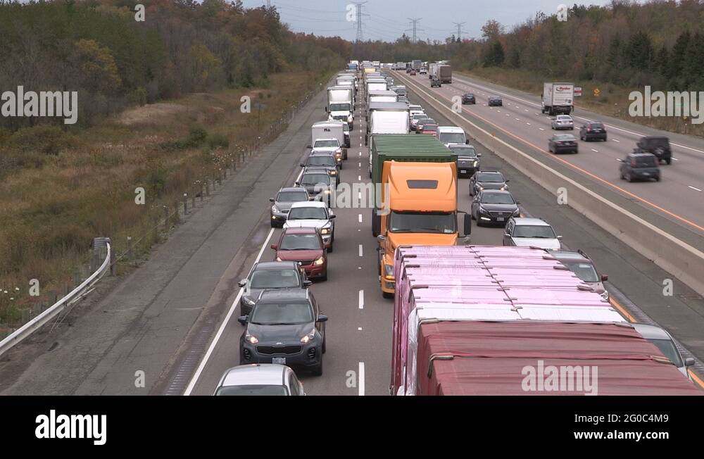 Tractor trailer trucks stuck in epic highway traffic jam and gridlock ...