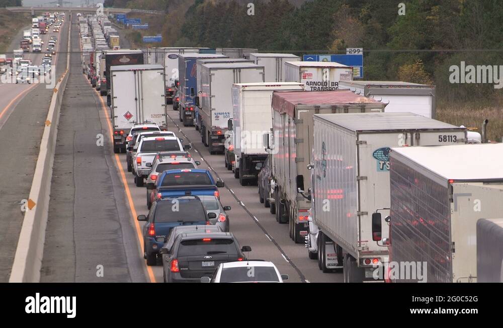 Tractor trailer trucks stuck in epic highway traffic jam and gridlock ...