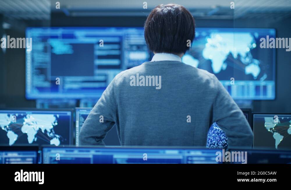 In the System Control Room Technical Operator Stands and Monitors ...