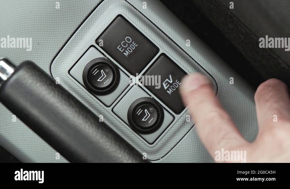 Activating the EV MODE of an Electric Car by Pressing a Button Stock ...