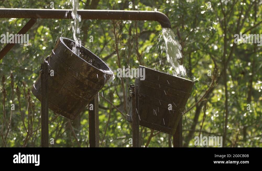 Wooden water buckets Stock Videos & Footage - HD and 4K Video Clips - Alamy