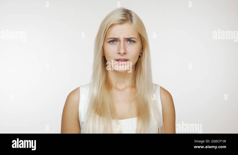 facial expressions of blondie girl politely saying no with caution ...