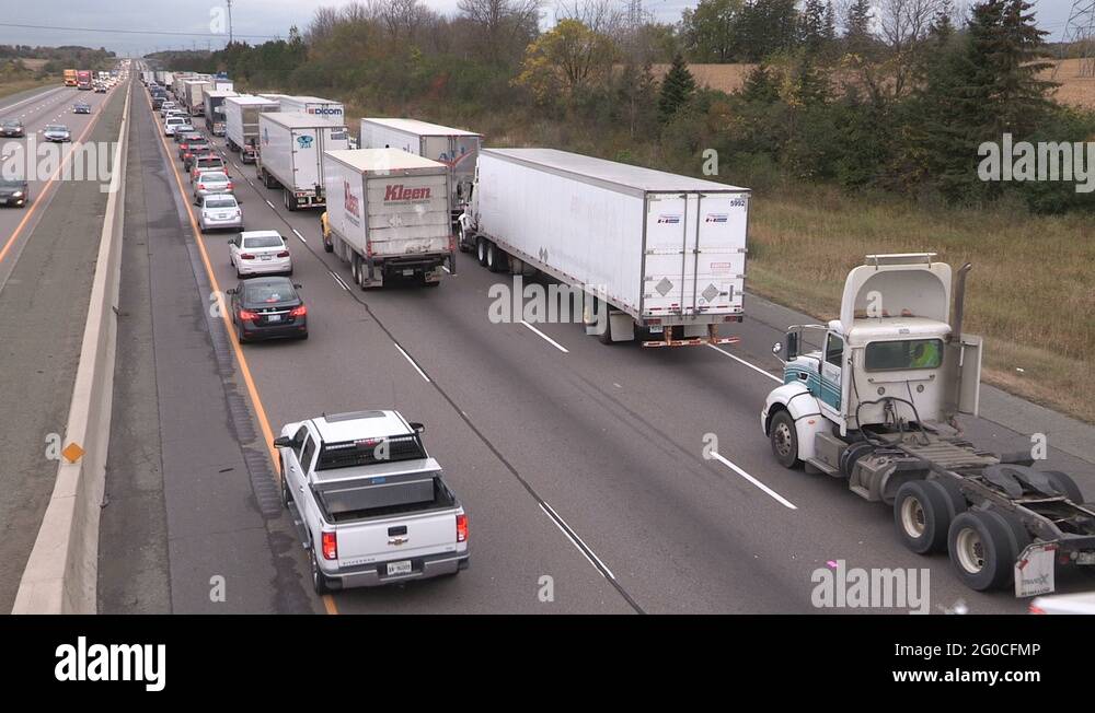 Tractor trailer trucks stuck in epic highway traffic jam and gridlock ...