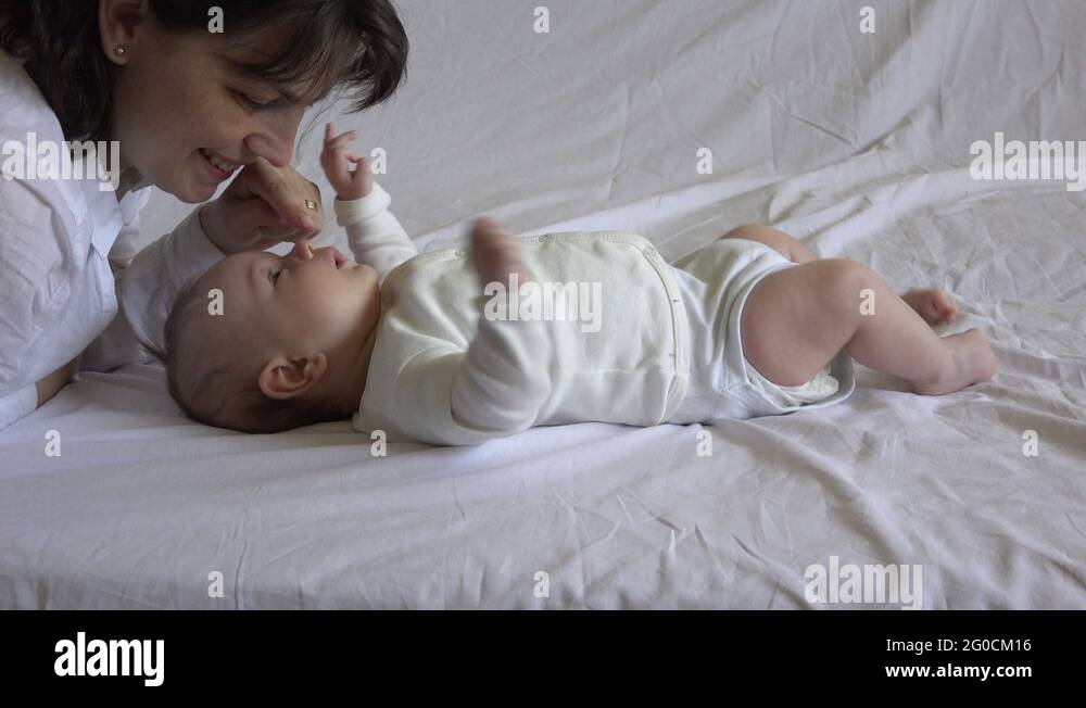 Newborn baby touching his face Stock Videos & Footage - HD and 4K Video ...