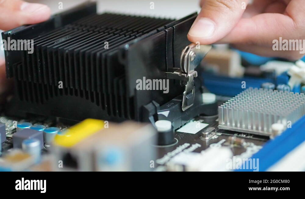 Removing And replacing CPU cooler on modern PC computer motherboard ...