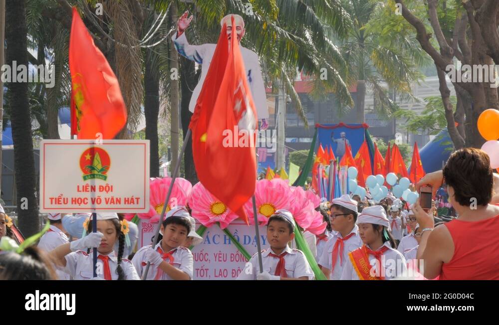 School kids at parade with Ho Chi Minh portrait,Saigon,Vietnam Stock ...