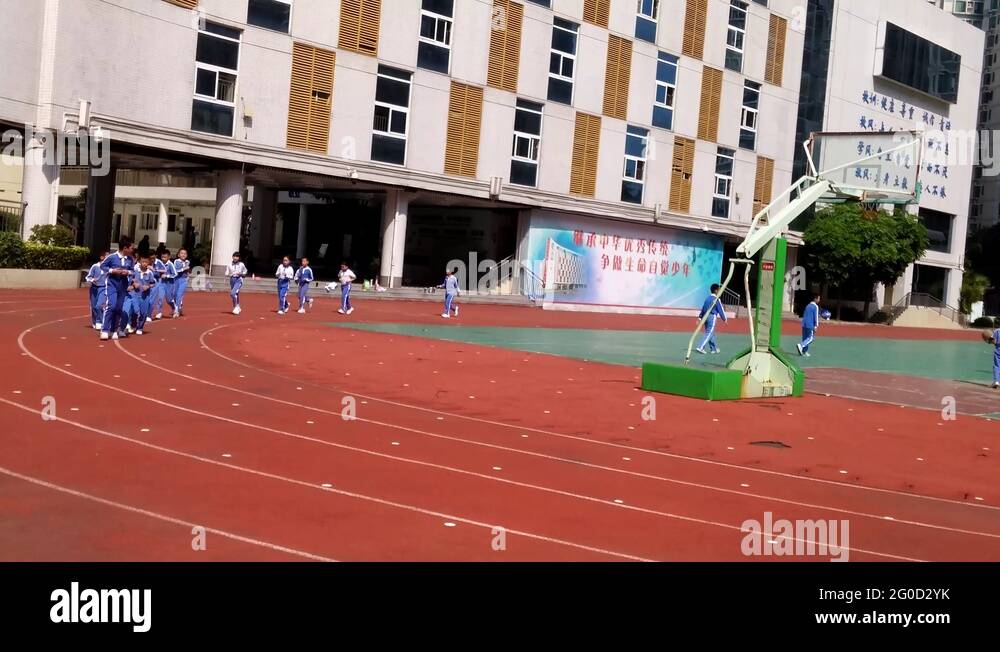 Chinese pupils have PE lessons on the playground Stock Video Footage ...