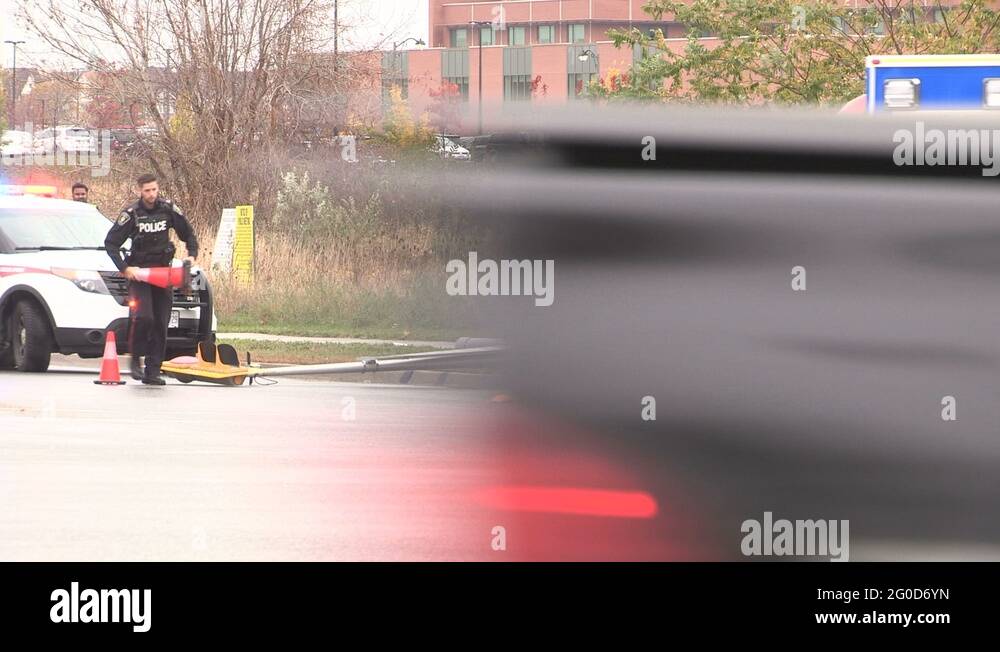 Car accident in city intersection with police and ambulance at scene ...
