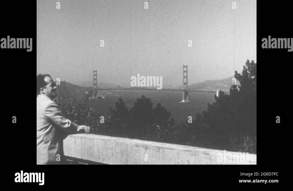 1950s: UNITED STATES: Golden Gate Bridge. Ship in port Stock Video ...