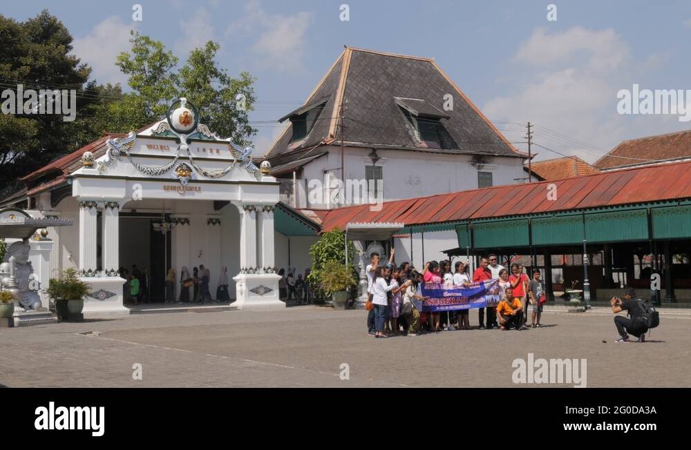 Tourists making group photo in Keraton palace in Yogyakarta Java ...
